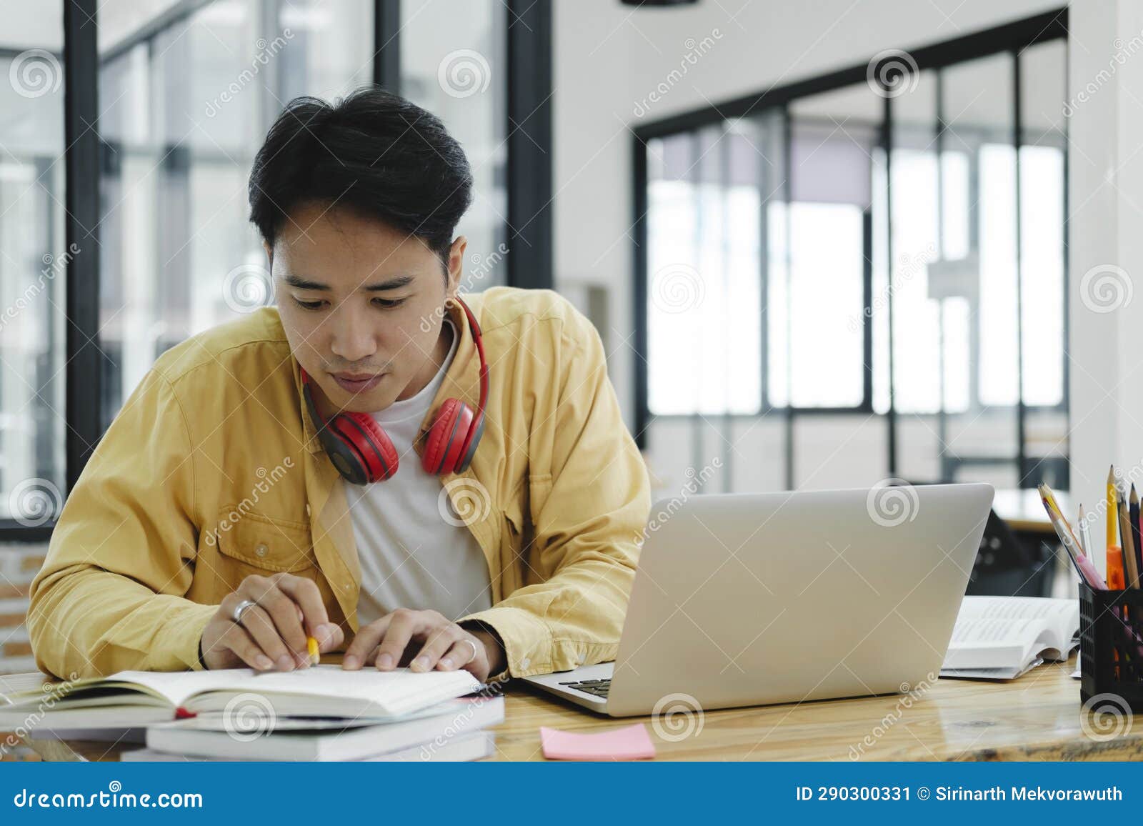 Young Collage Student Using Computer and Mobile Device Studying Online ...