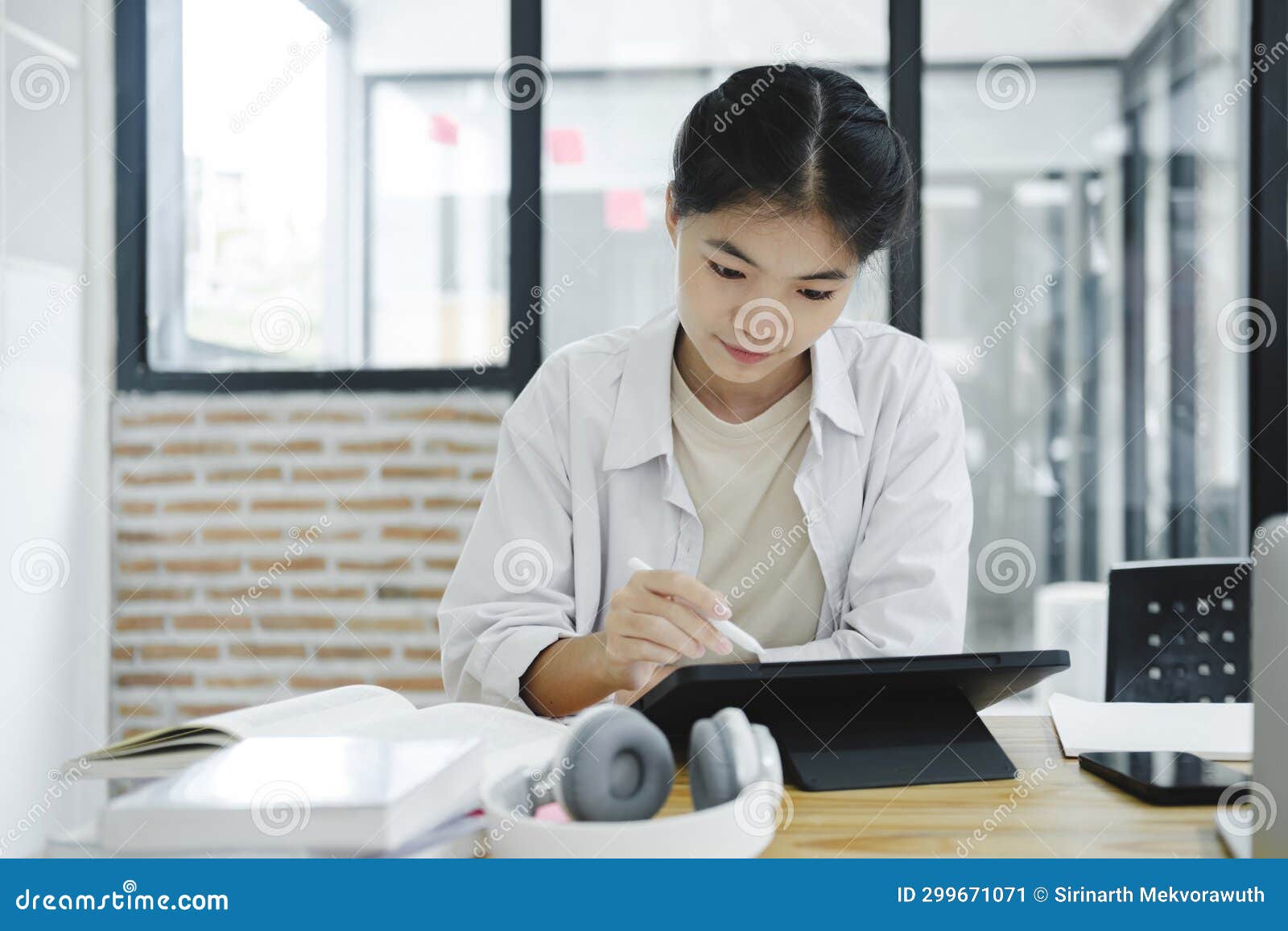 Young Collage Student Using Computer and Mobile Device Studying Online ...