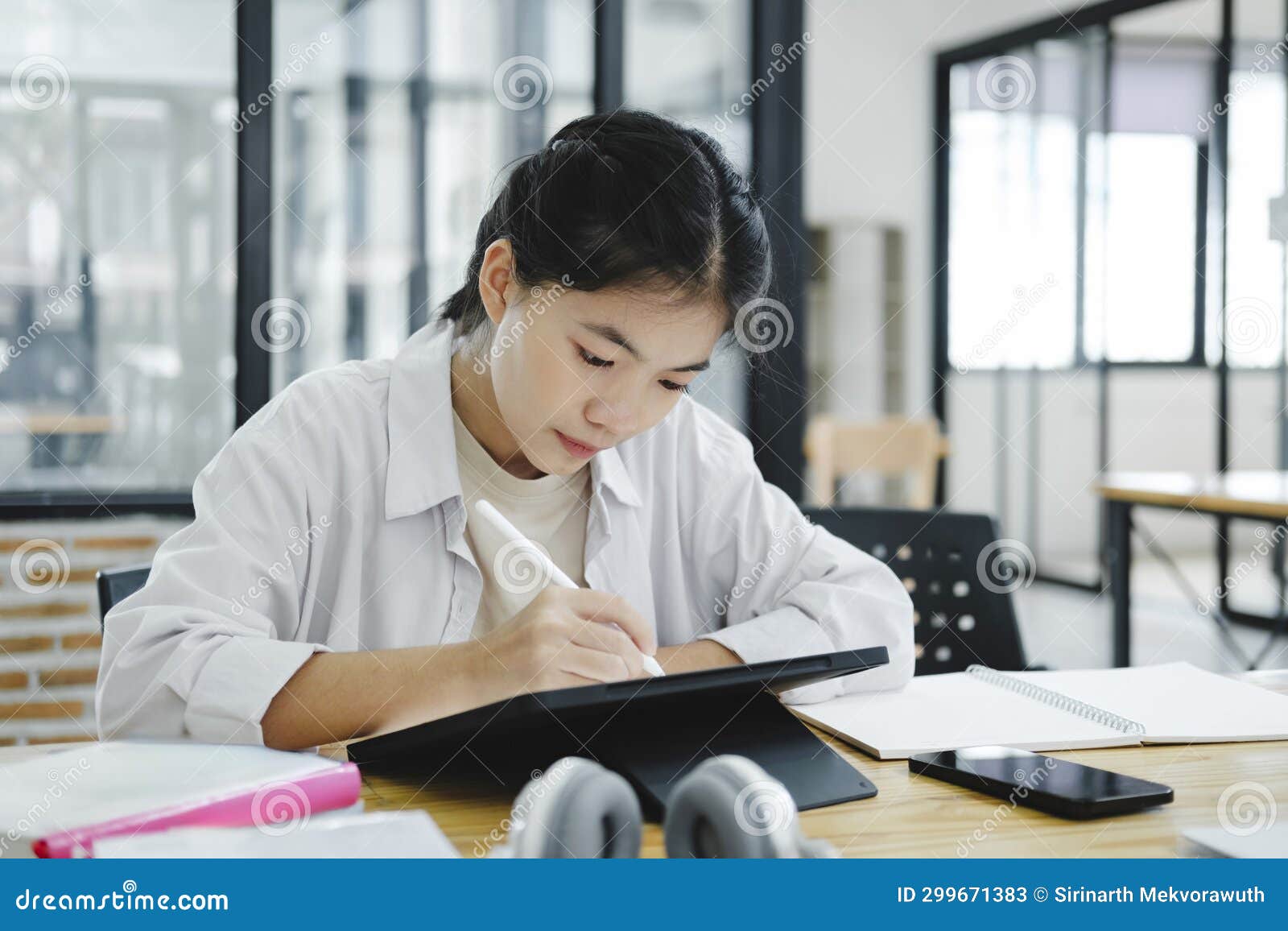 Young Collage Student Using Computer and Mobile Device Studying Online ...
