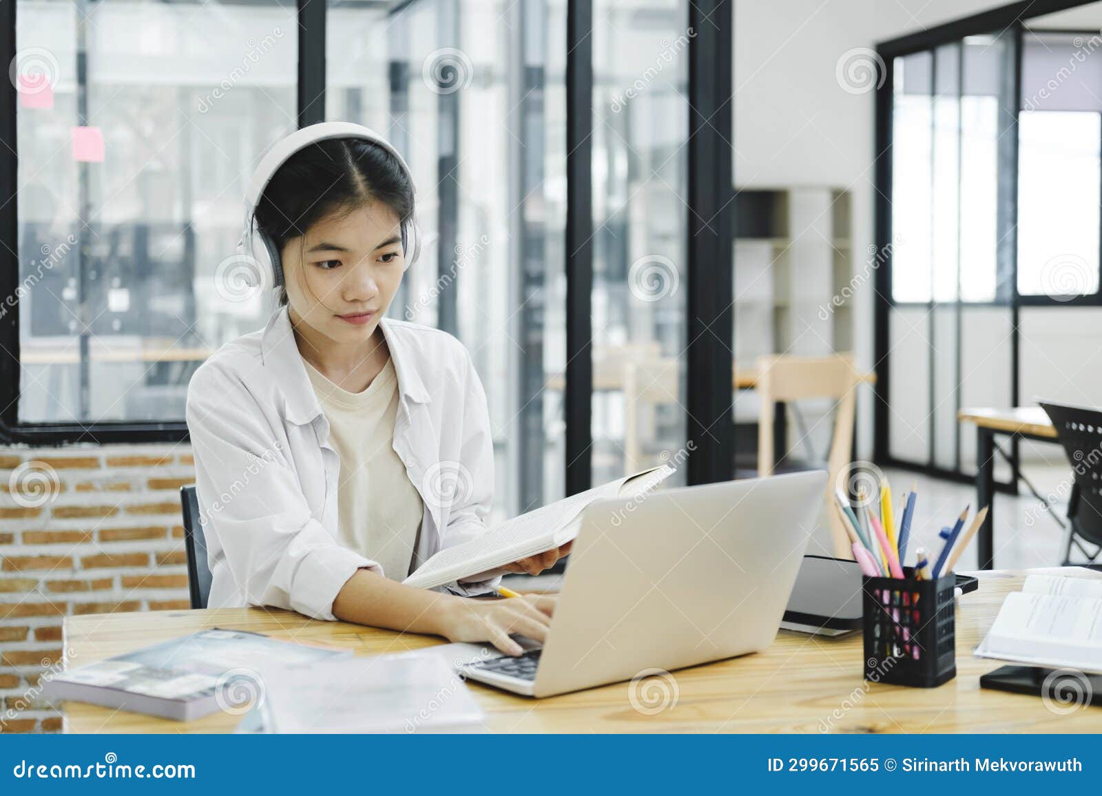 Young Collage Student Using Computer and Mobile Device Studying Online ...