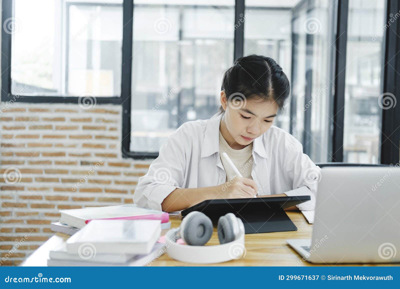 Young Collage Student Using Computer and Mobile Device Studying Online ...