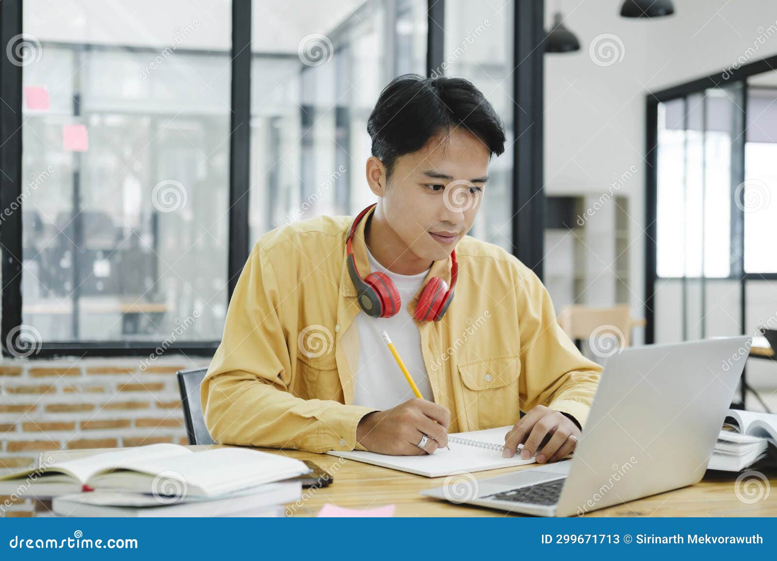 Young Collage Student Using Computer and Mobile Device Studying Online ...