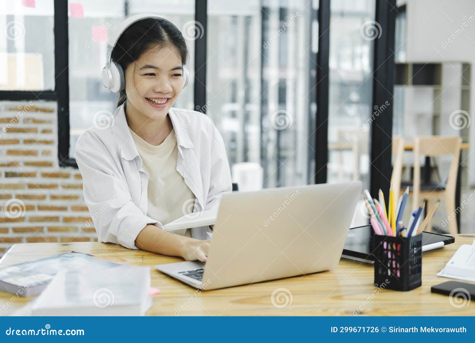 Young Collage Student Using Computer and Mobile Device Studying Online ...