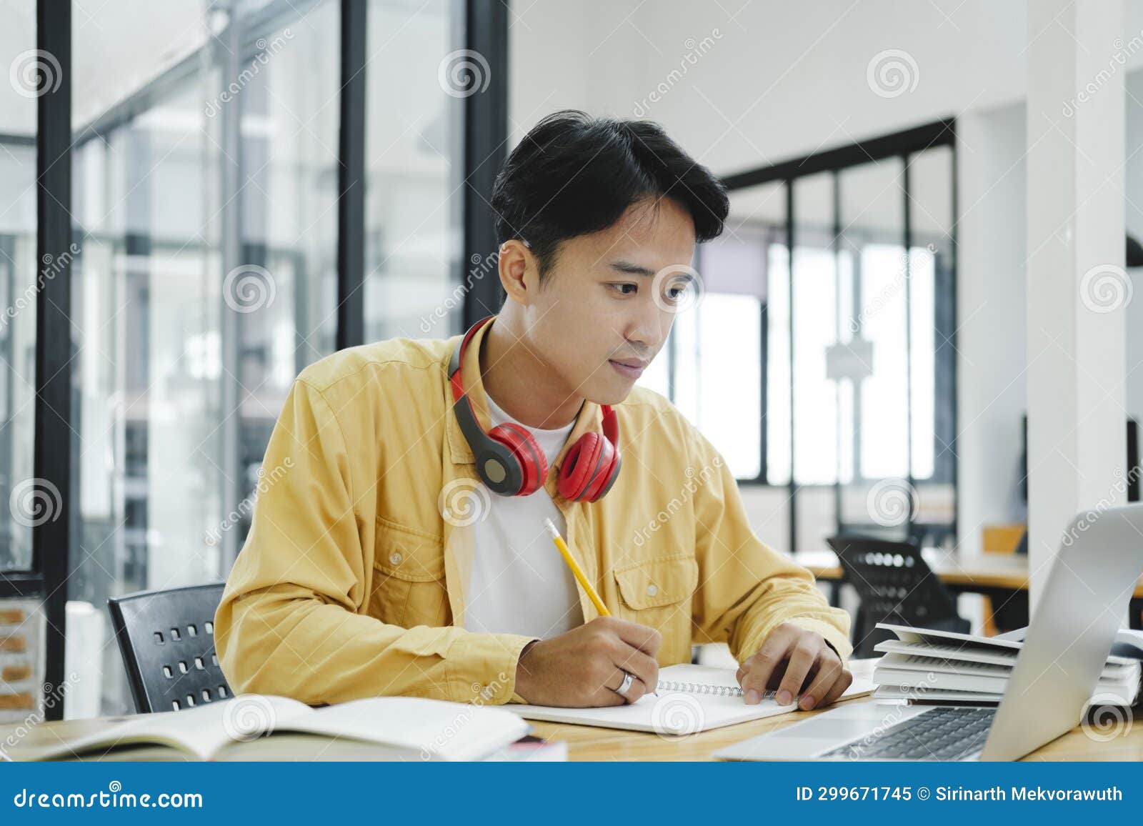 Young Collage Student Using Computer and Mobile Device Studying Online ...