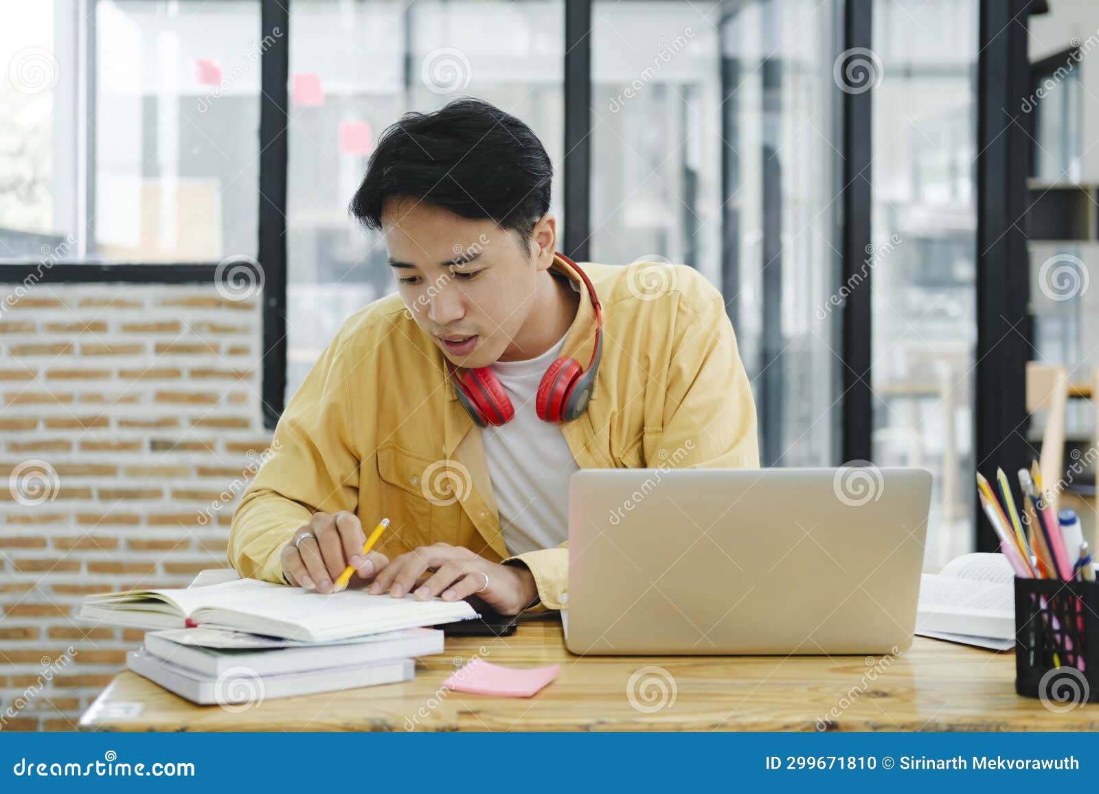 Young Collage Student Using Computer and Mobile Device Studying Online ...