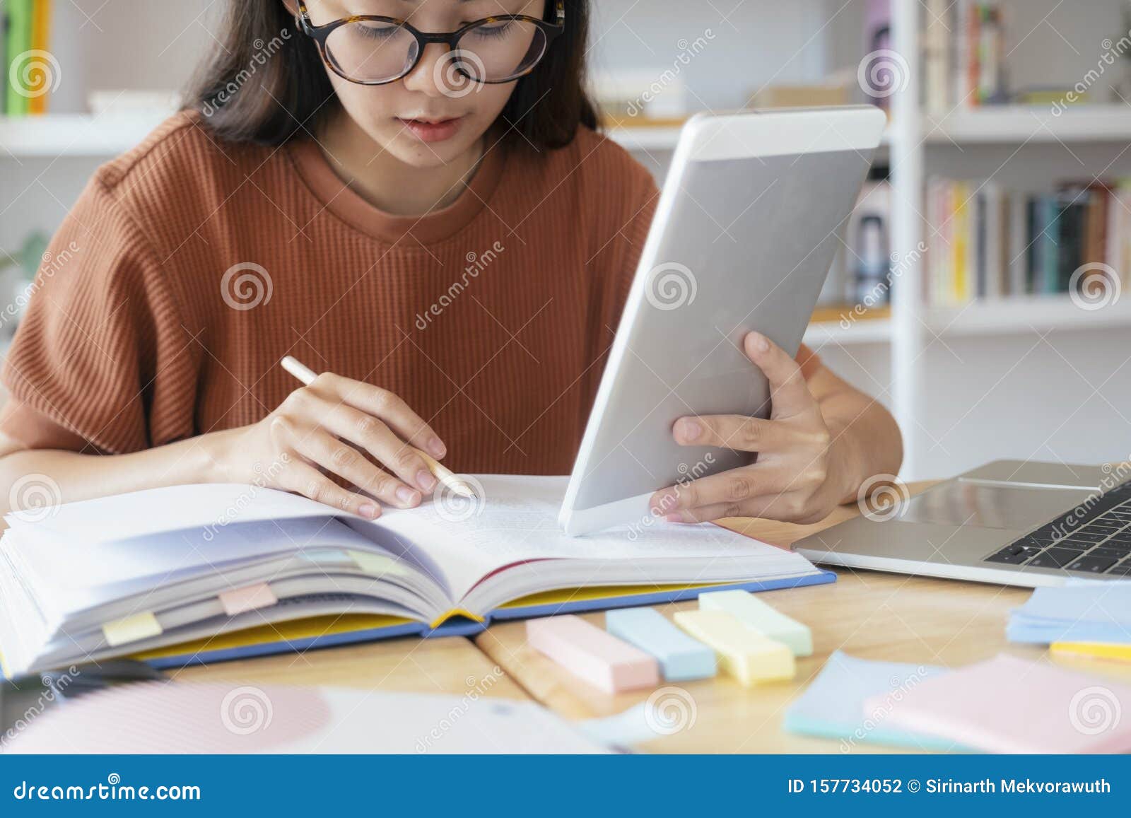 Young Collage Student Using Computer and Mobile Device Studying Online ...