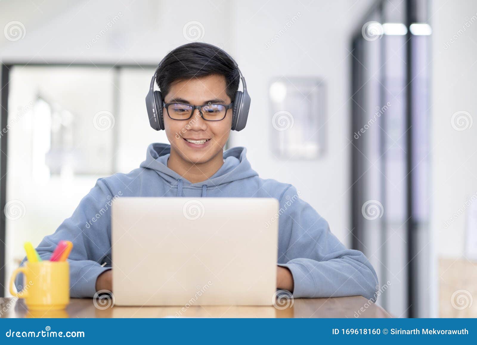 Young Collage Student Using Computer and Mobile Device Studying Online ...
