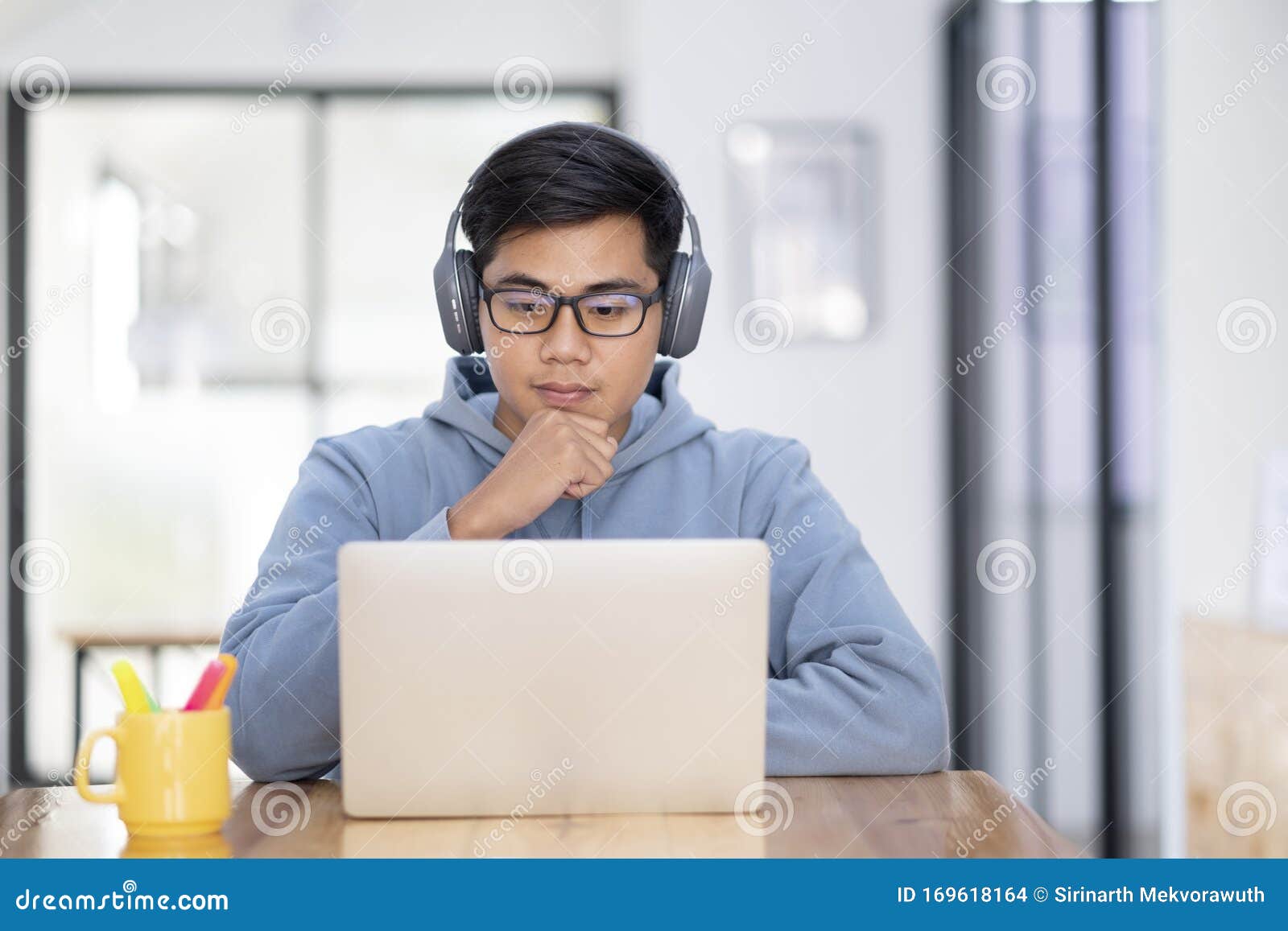 Young Collage Student Using Computer and Mobile Device Studying Online ...