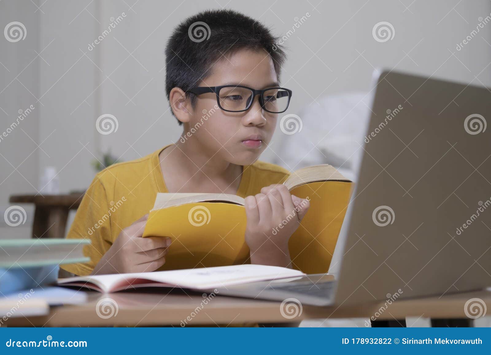 Young Collage Student Using Computer and Mobile Device Studying Online ...