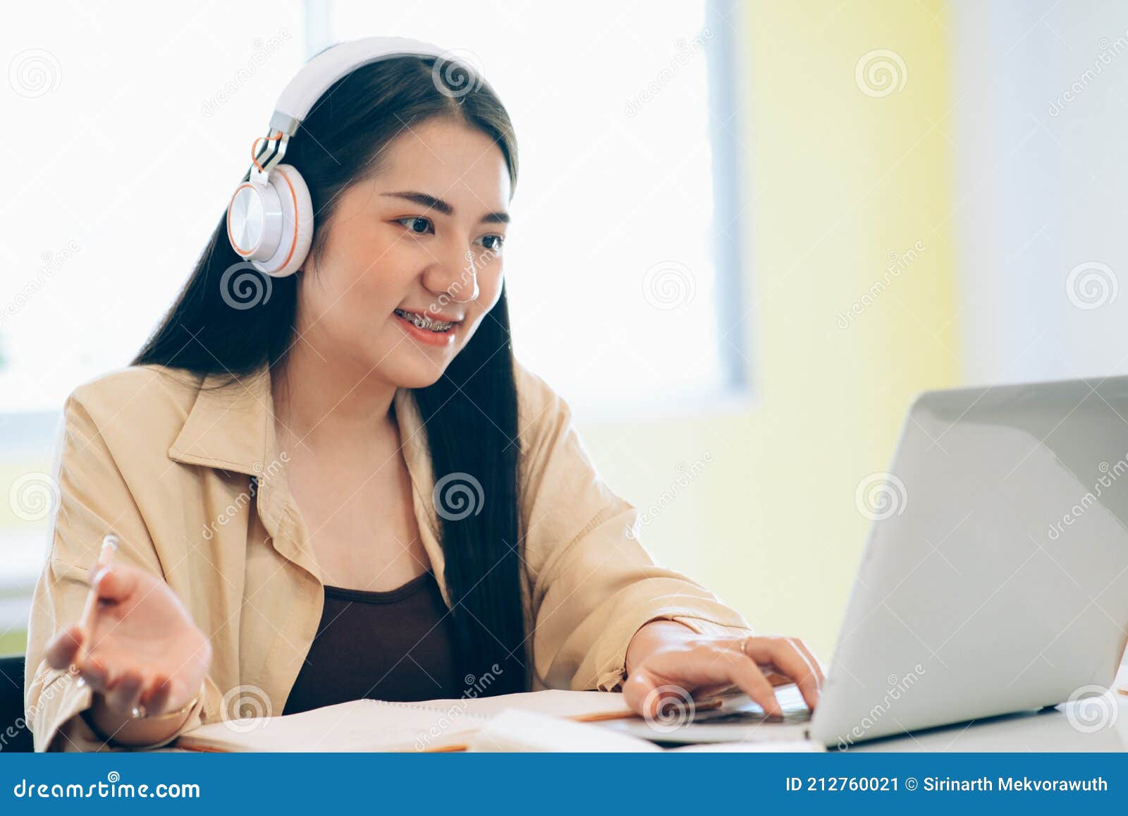 Young Collage Student Using Computer and Mobile Device Studying Online ...