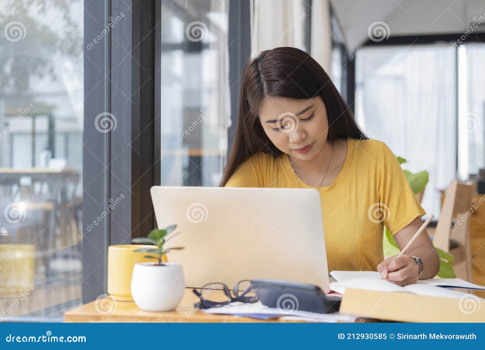 Young Collage Student Using Computer and Mobile Device Studying Online ...
