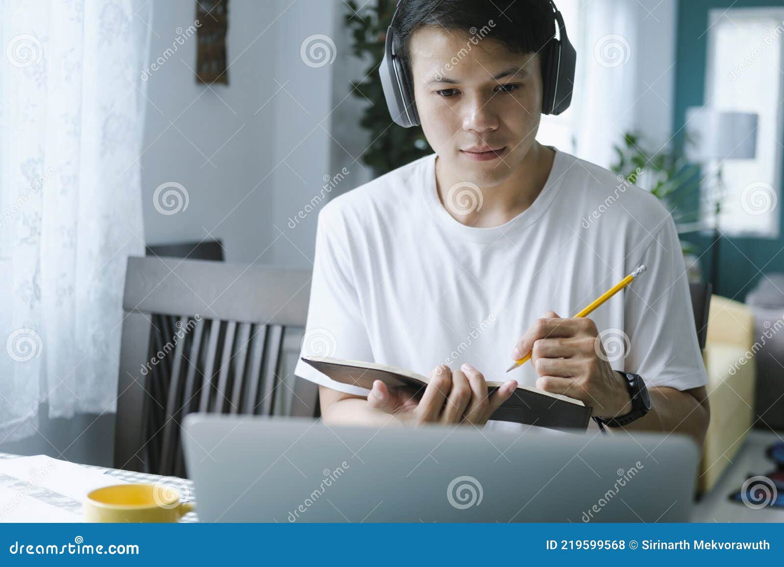 Young Collage Student Using Computer and Mobile Device Studying Online ...