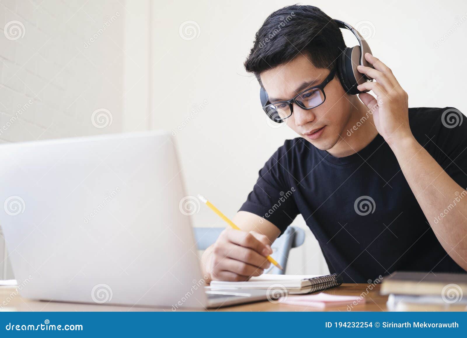 Young Collage Student Using Computer and Mobile Device Studying Online ...