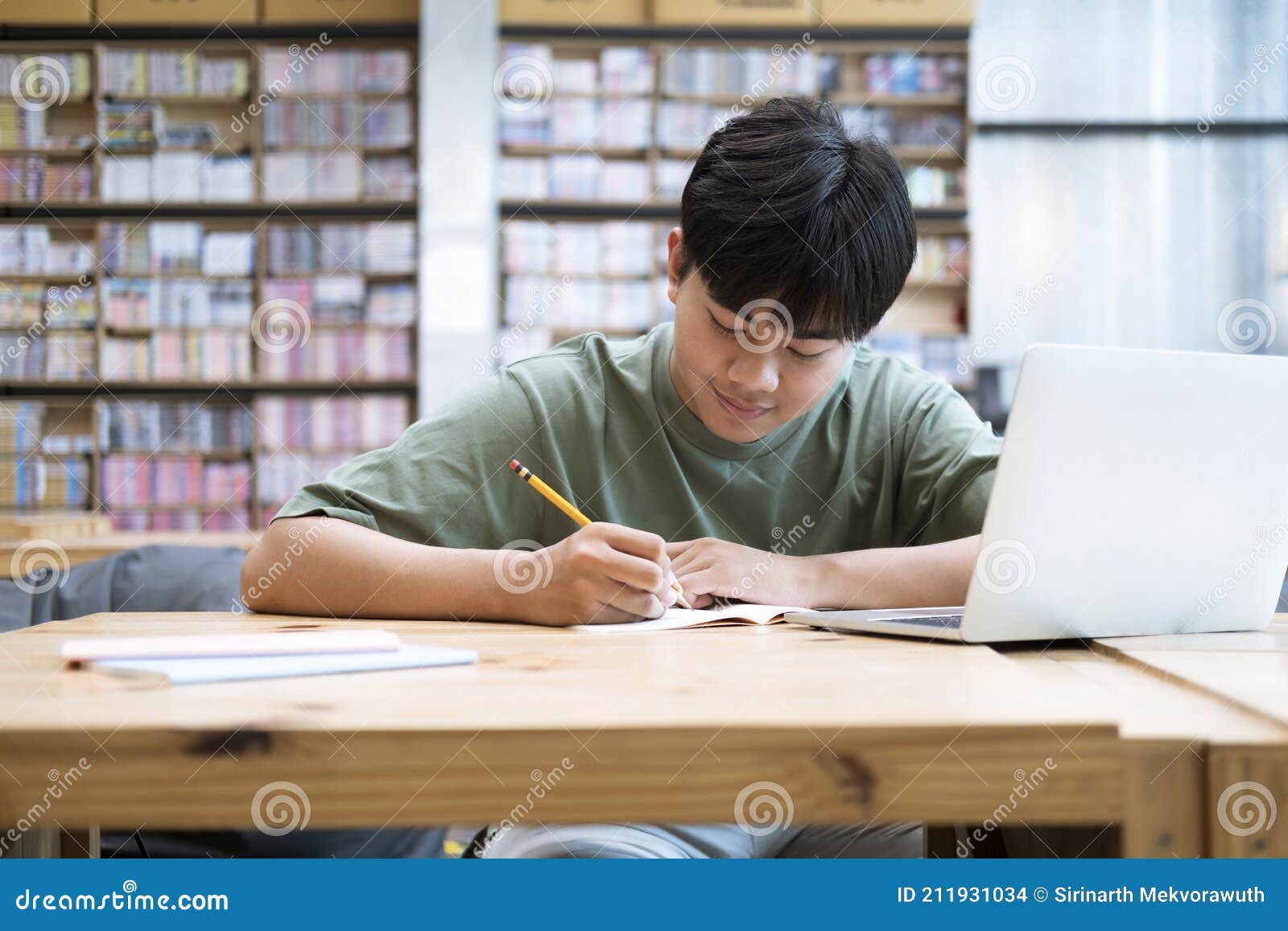 Young Collage Student Using Computer and Mobile Device Studying Online ...