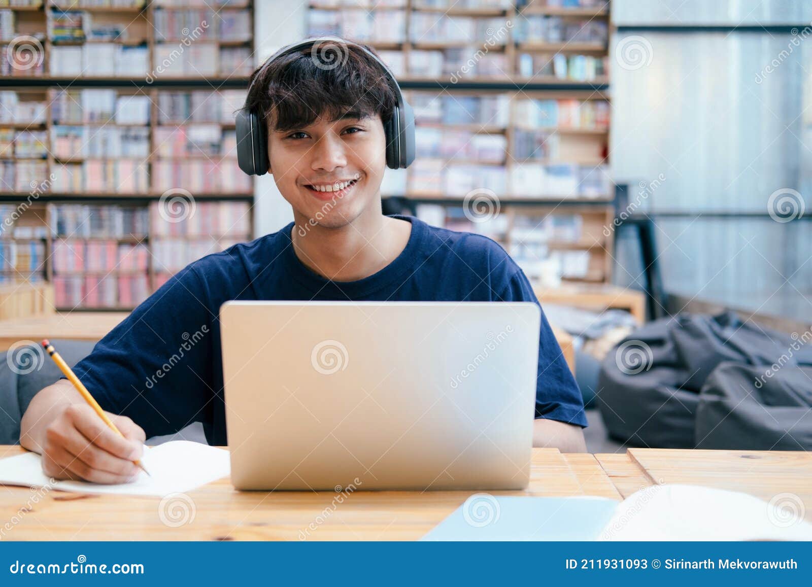 Young Collage Student Using Computer and Mobile Device Studying Online ...