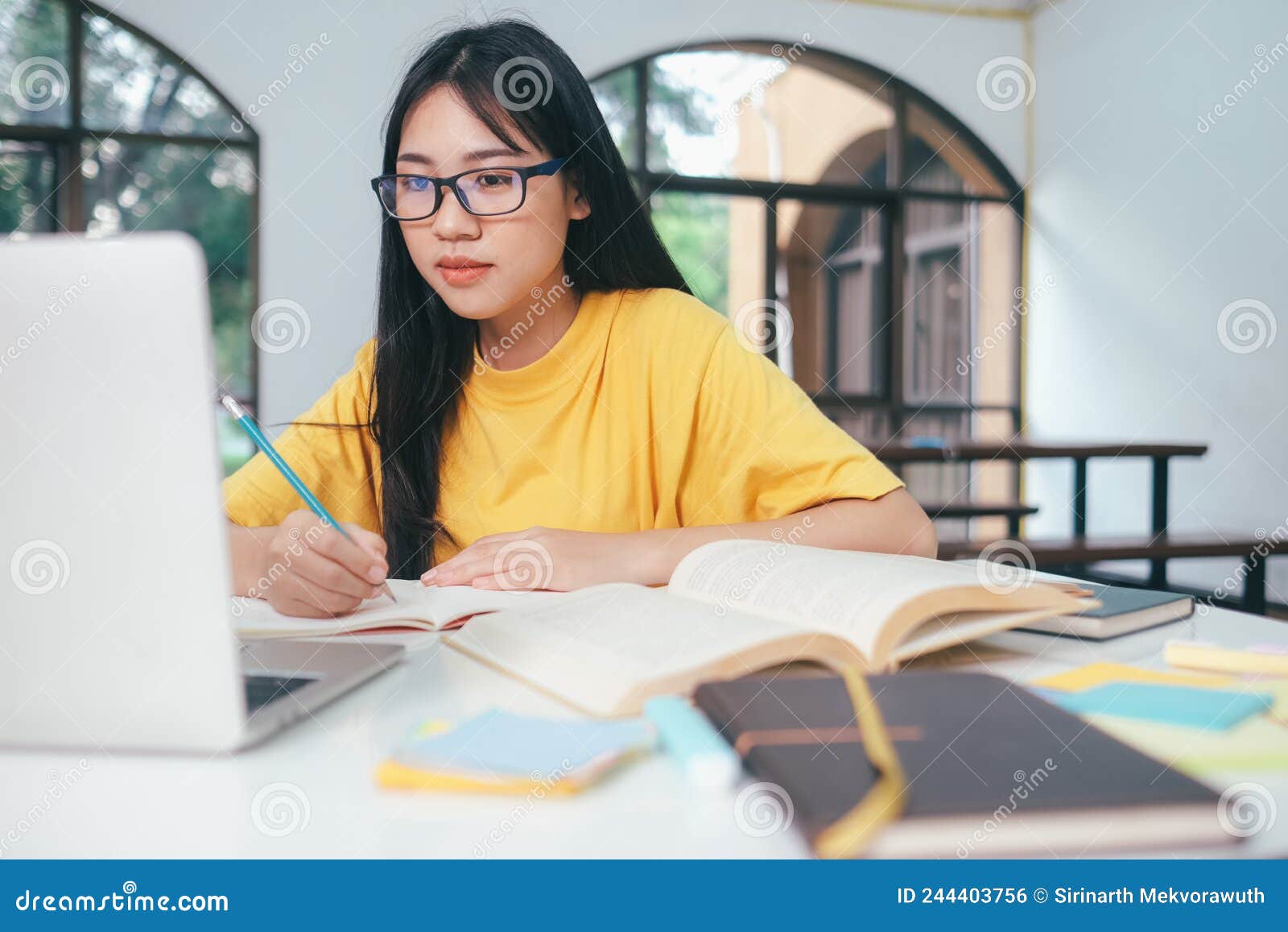 Young Collage Student Using Computer and Mobile Device Studying Online ...