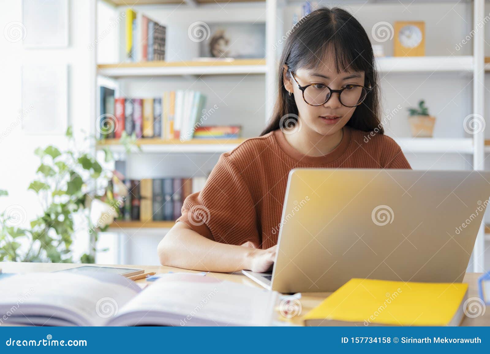 Young Collage Student Using Computer and Mobile Device Studying Online ...