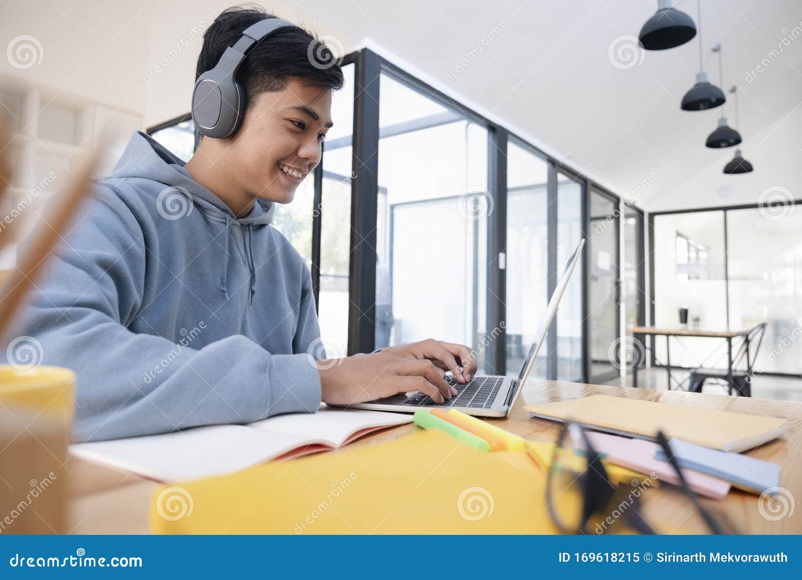 Young Collage Student Using Computer and Mobile Device Studying Online ...