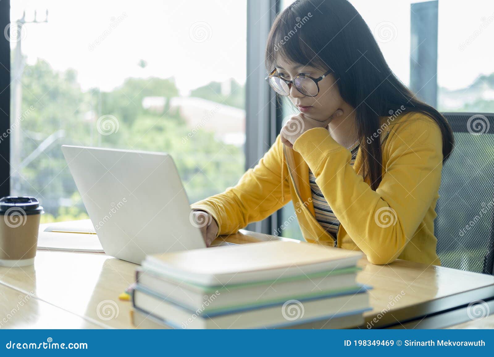Young Collage Student Using Computer and Mobile Device Studying Online ...
