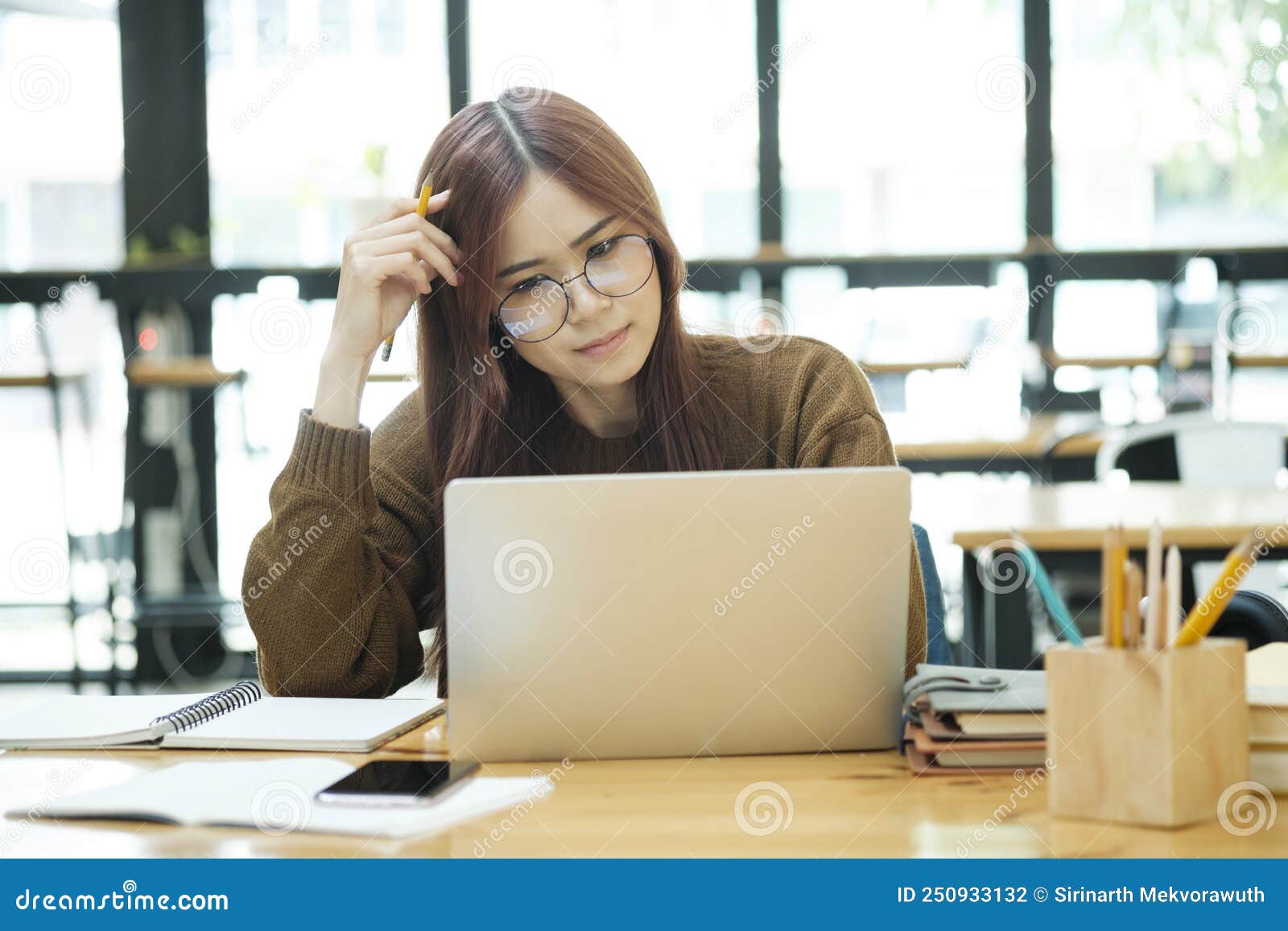 Young Collage Student Using Computer and Mobile Device Studying Online ...