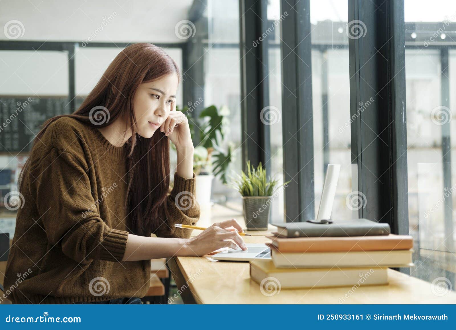 Young Collage Student Using Computer and Mobile Device Studying Online ...