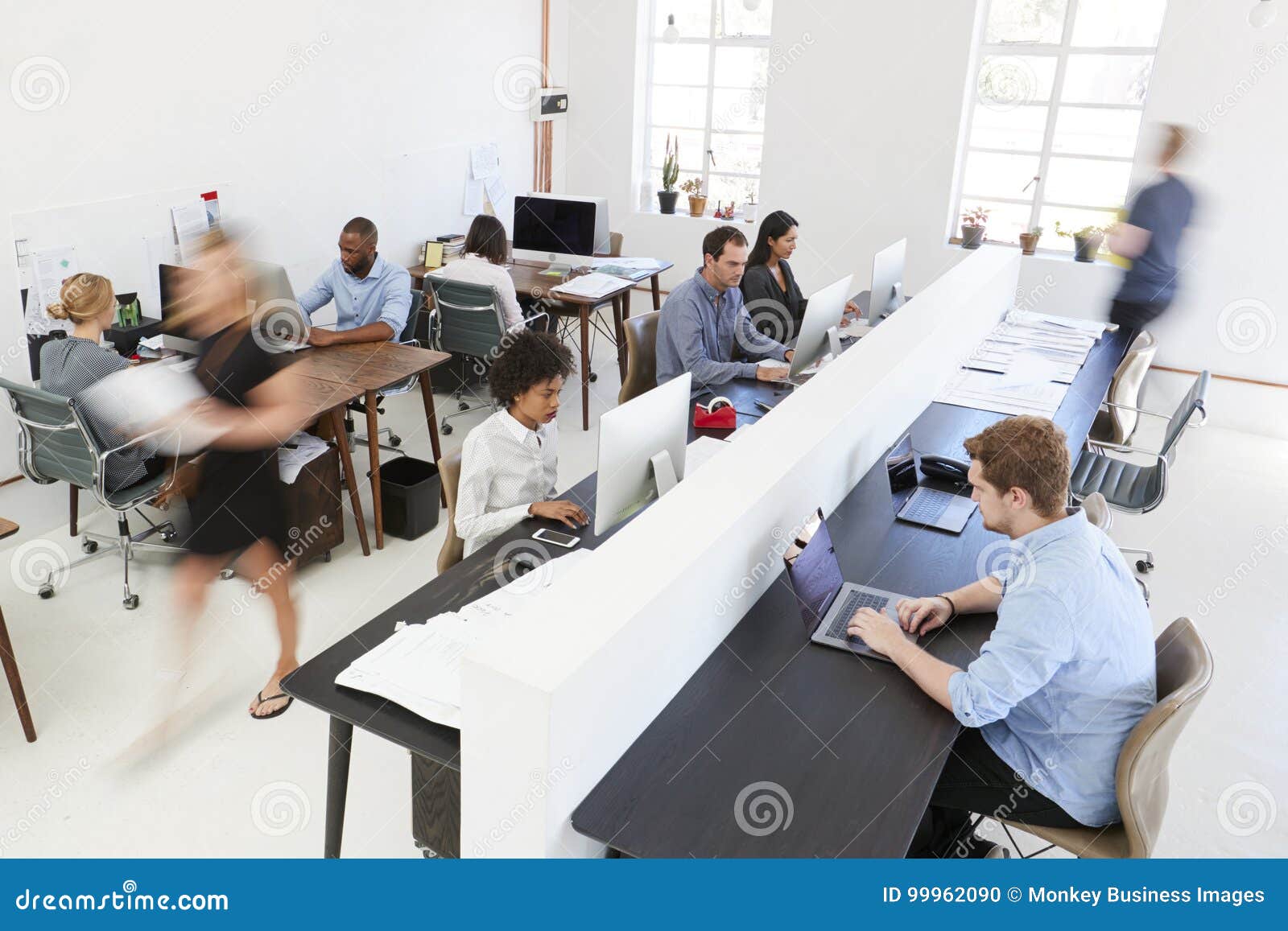 Young Colleagues at Computers in a Busy Open Plan Office Stock Photo ...