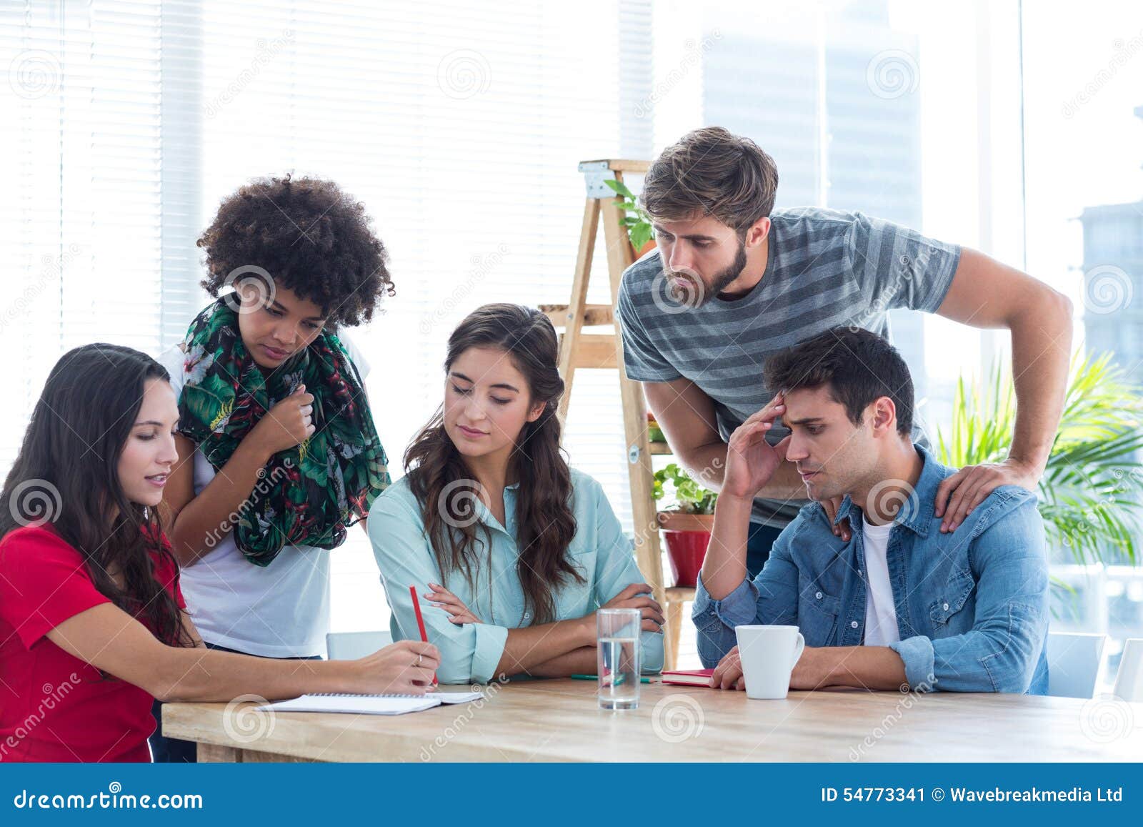 Young Colleagues in Discussion at Office Stock Image - Image of ...