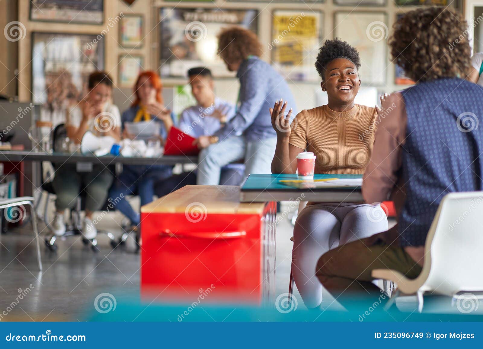 Young Colleagues in a Good Mood while Working in the Office Together ...