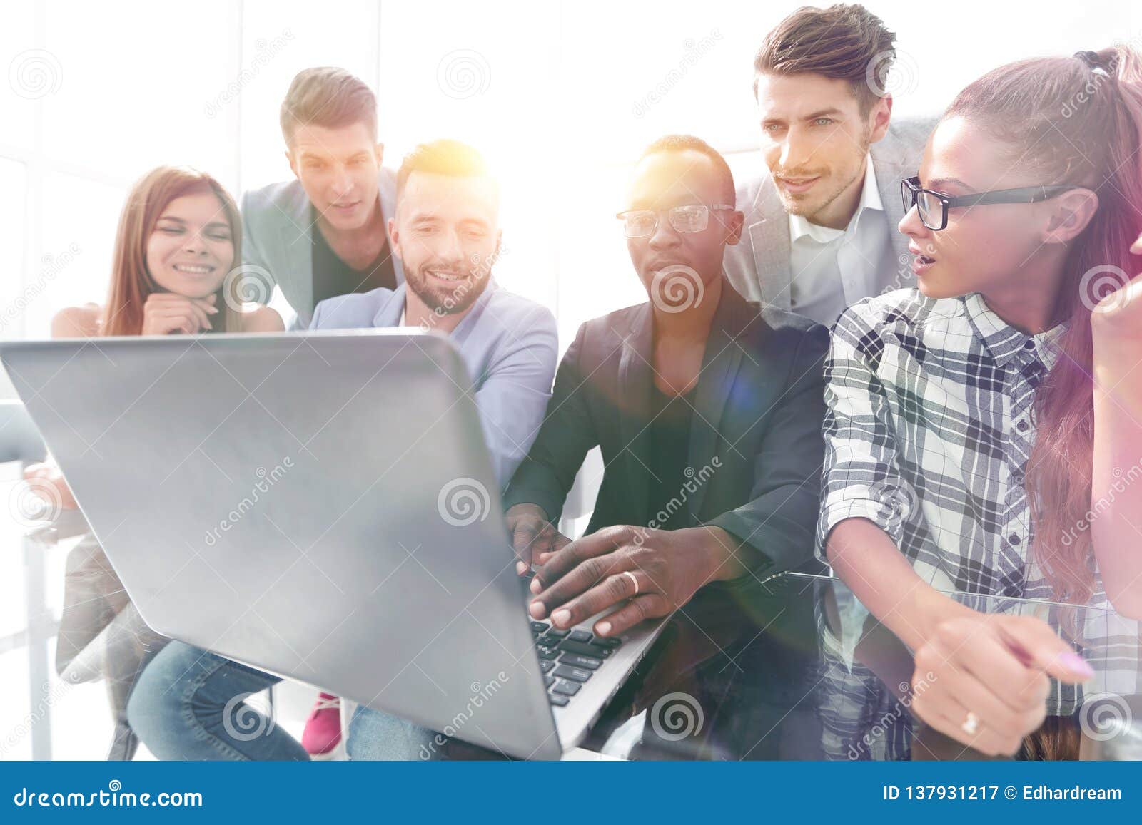 Young Colleagues Looking at Laptop with Smile on Face Stock Image ...