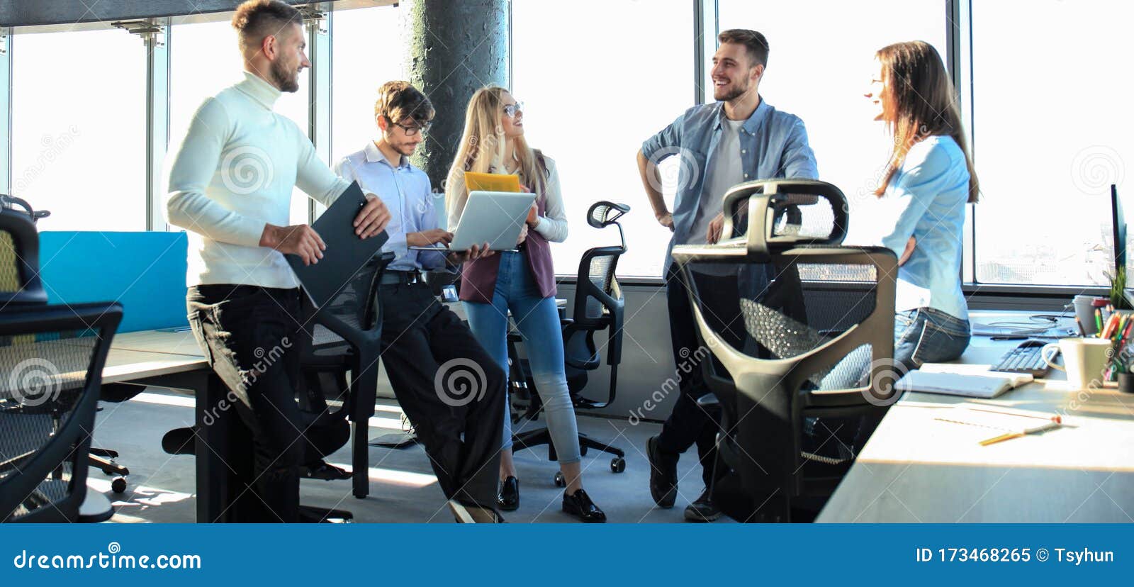 Young Colleagues in Smart Casual Wear Working while Spending Time in ...