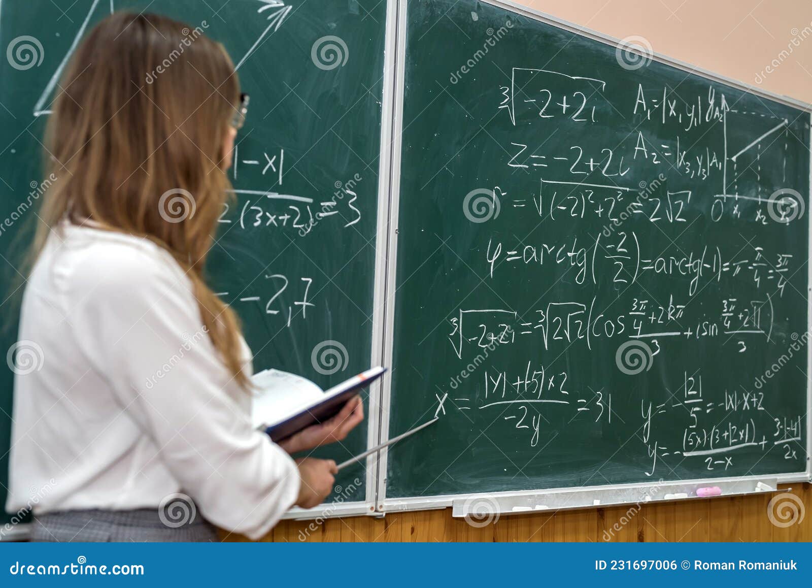 Young College Student Writing Mathematical Exercise on the Chalkboard ...