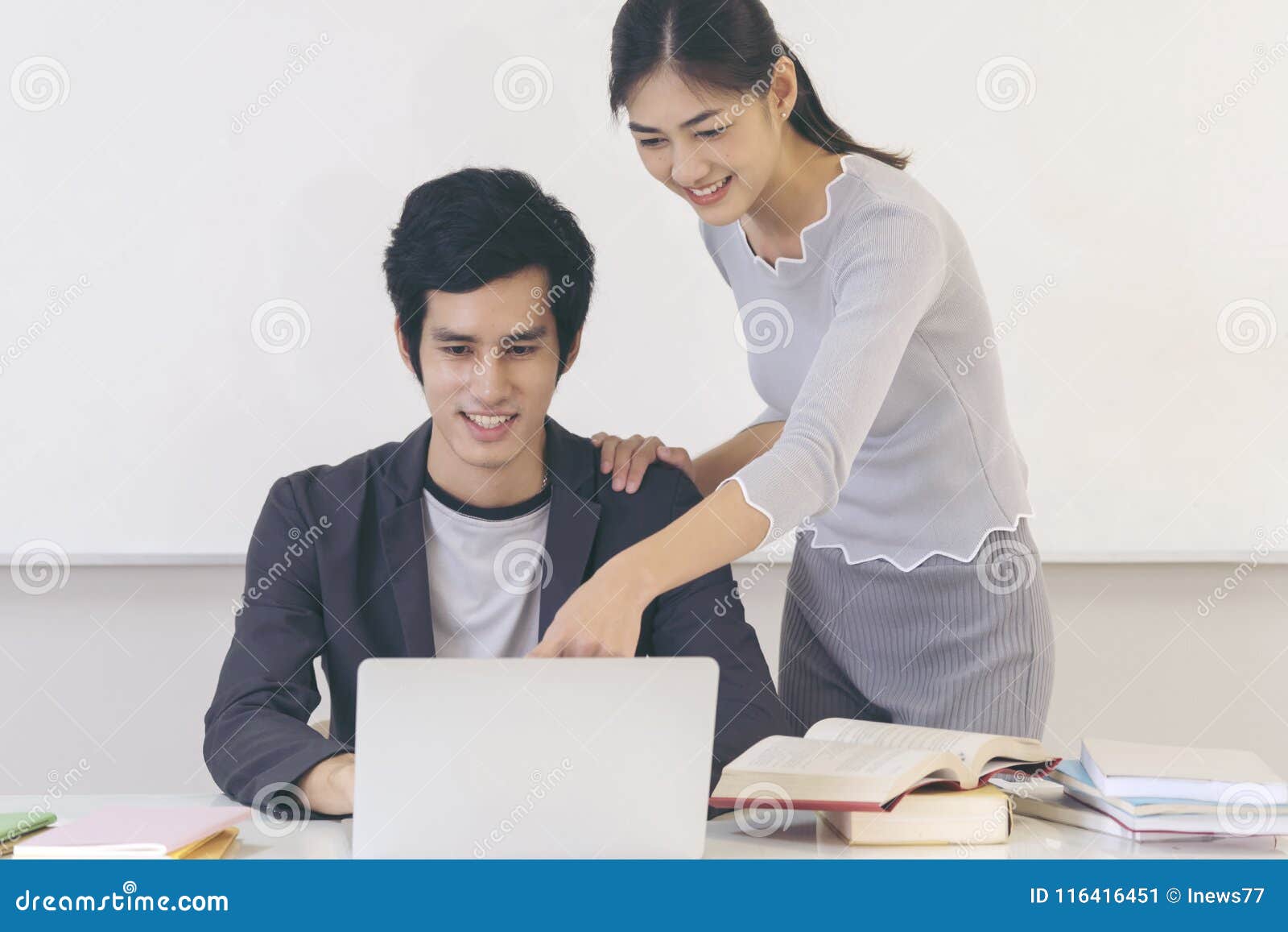 Young College Students Doing Homework Together in Class. Stock Image ...