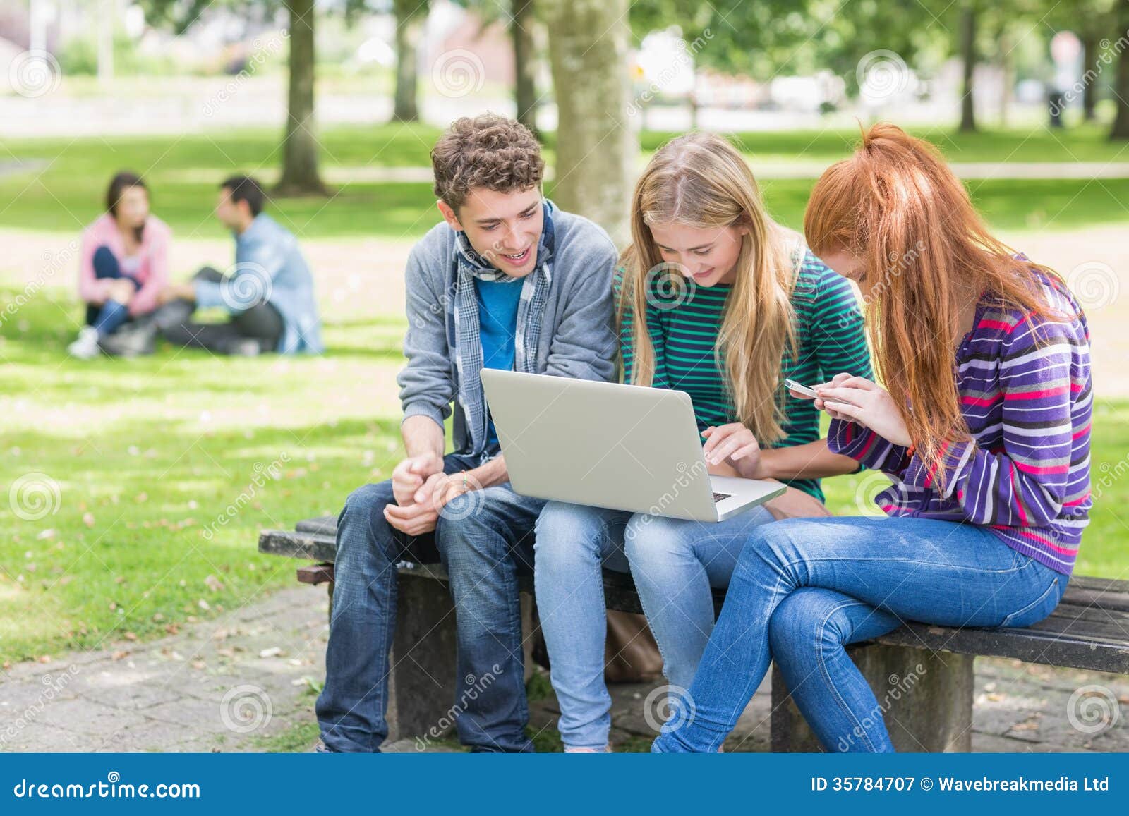 Young College Students Using Laptop in Park Stock Image - Image of ...