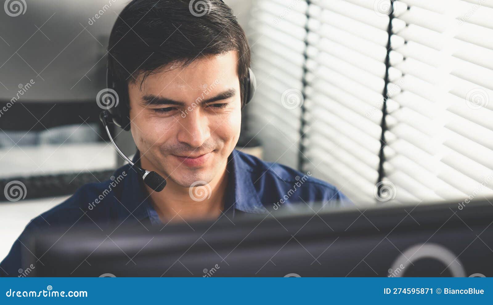 Young Competent Asian Male Call Center Agent Working in the Office ...