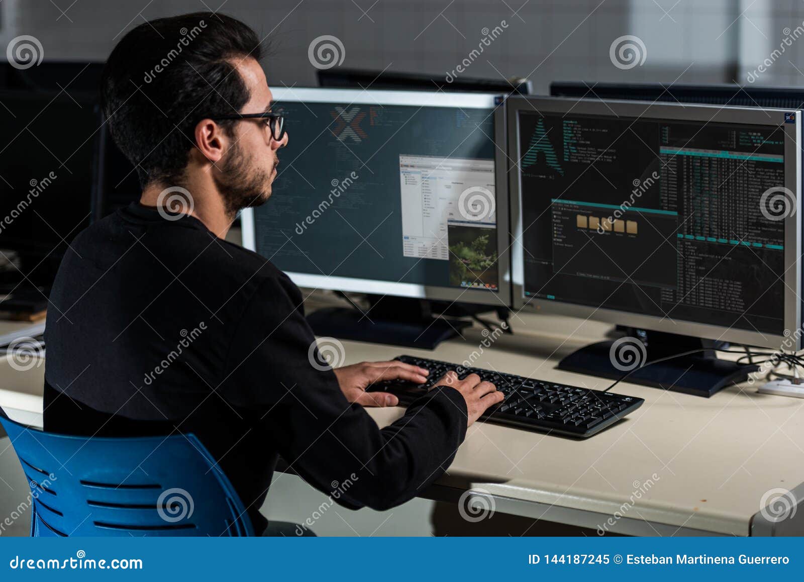 Young Computer Science Student Developing with His Computer on a Linux ... Young Computer Science Student Developing with His Computer on a Linux ...