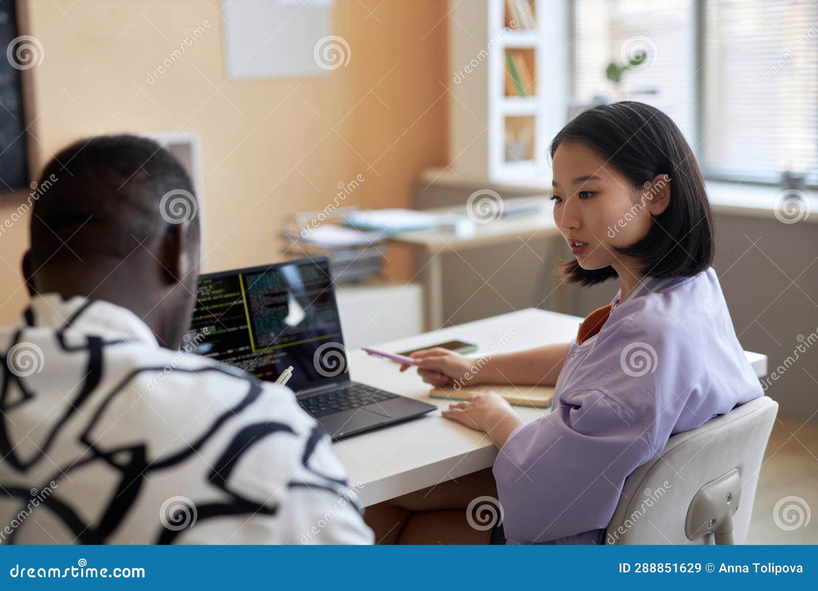 Young Confident Asian Woman Looking at Her Classmate during Discussion ...