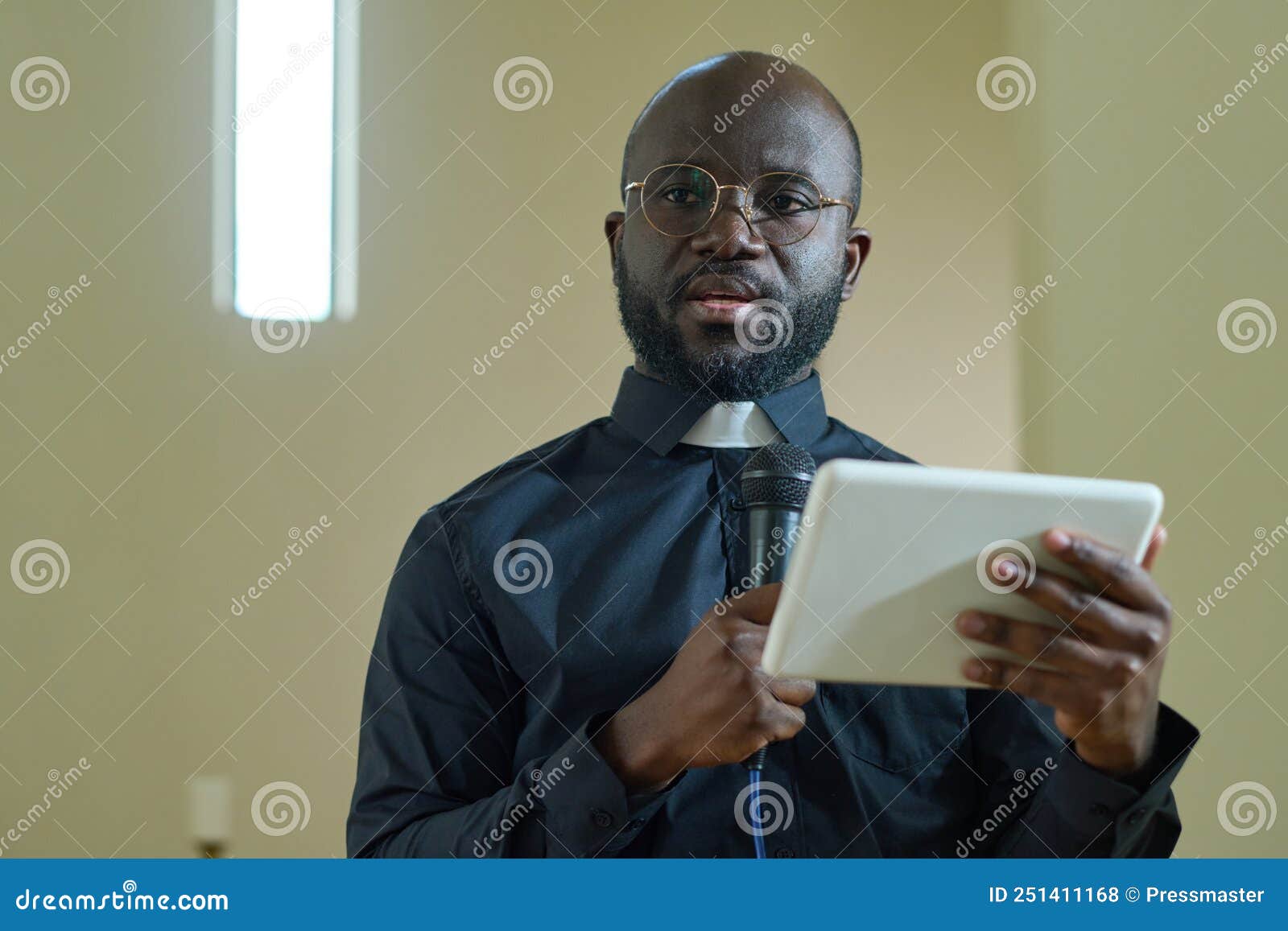 Young Confident Black Man with Microphone and Digital Tablet Making ...