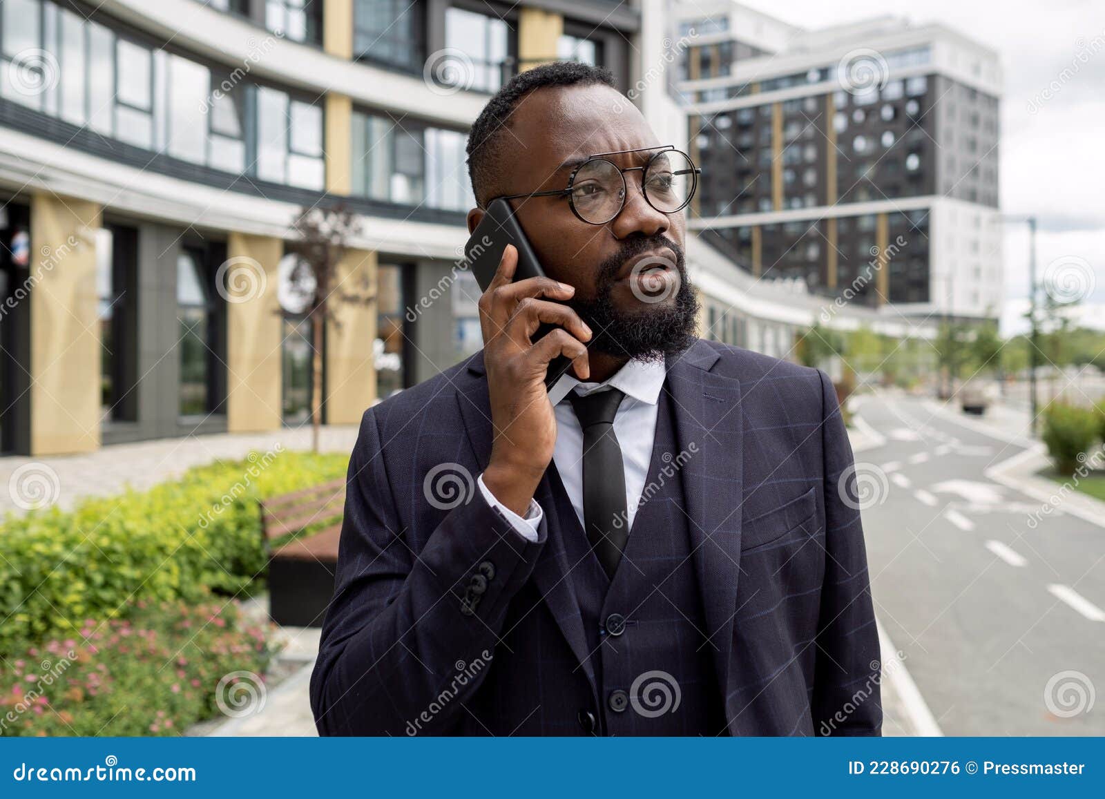 Young Confident Broker with Smartphone by Ear Consulting Client Stock ...