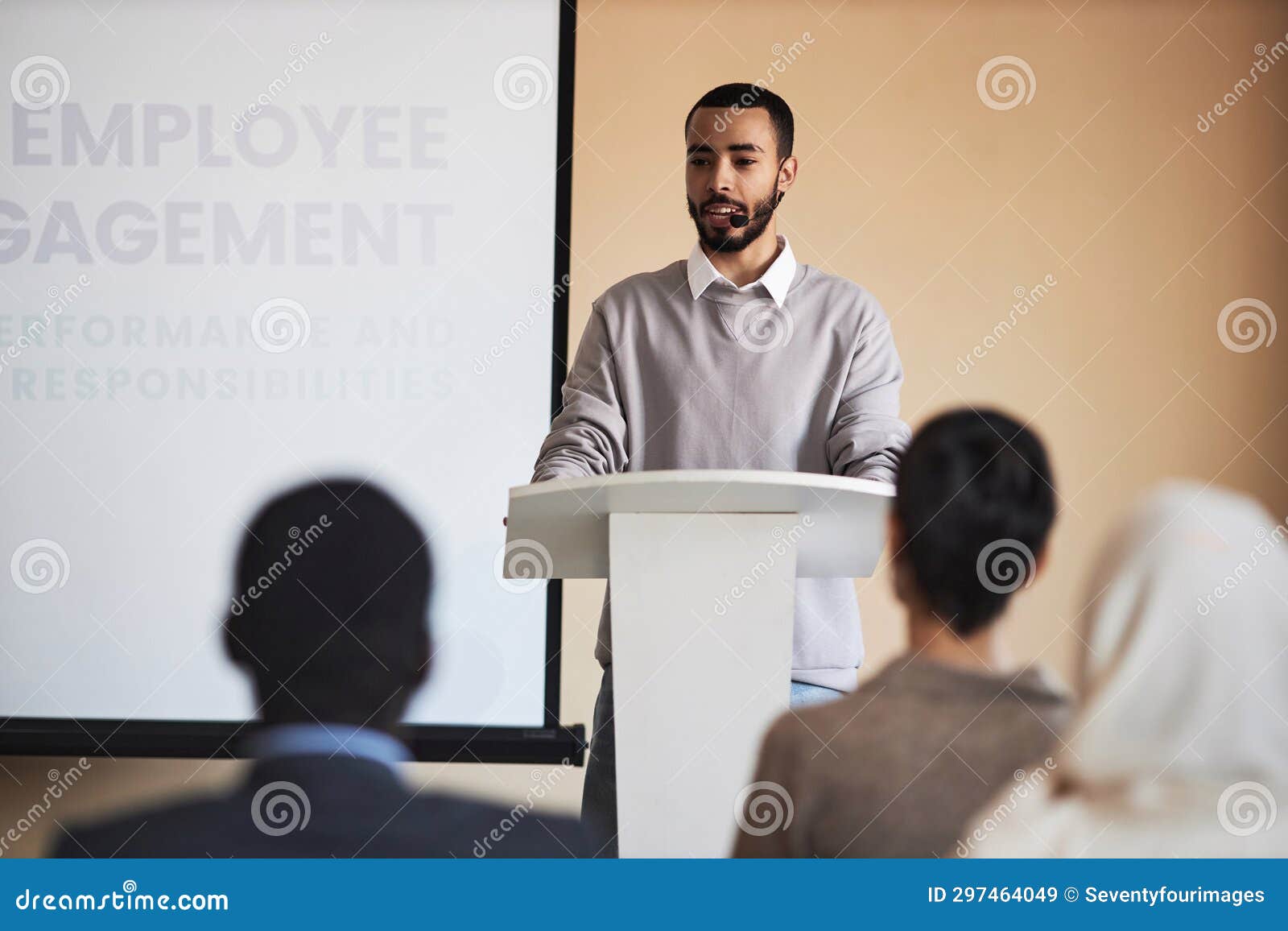 Young Confident Multiethnic HR Coach Standing in Front of Audience ...