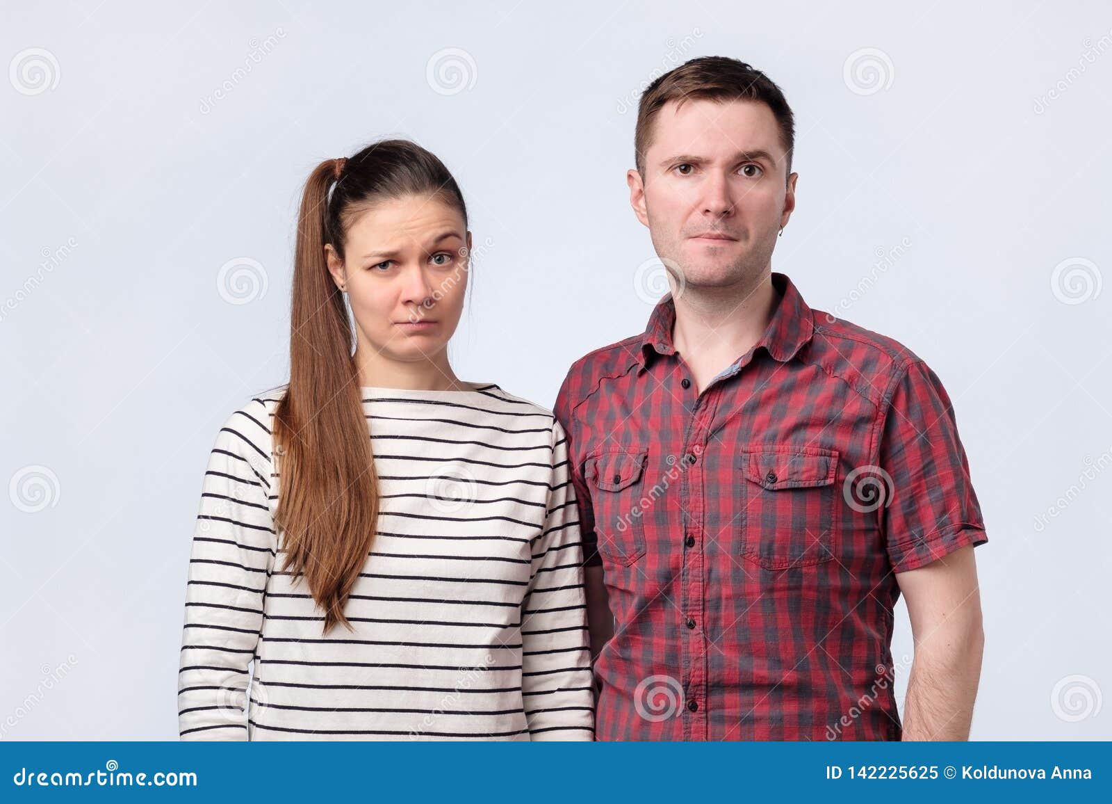 Young Confused Couple Looking Puzzled at Camera. Stock Image - Image of ...