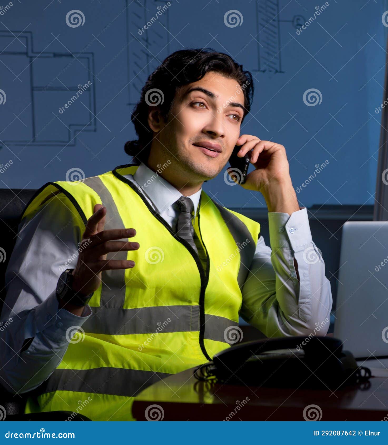 Young Construction Architect Working on Project at Night Stock Photo ...