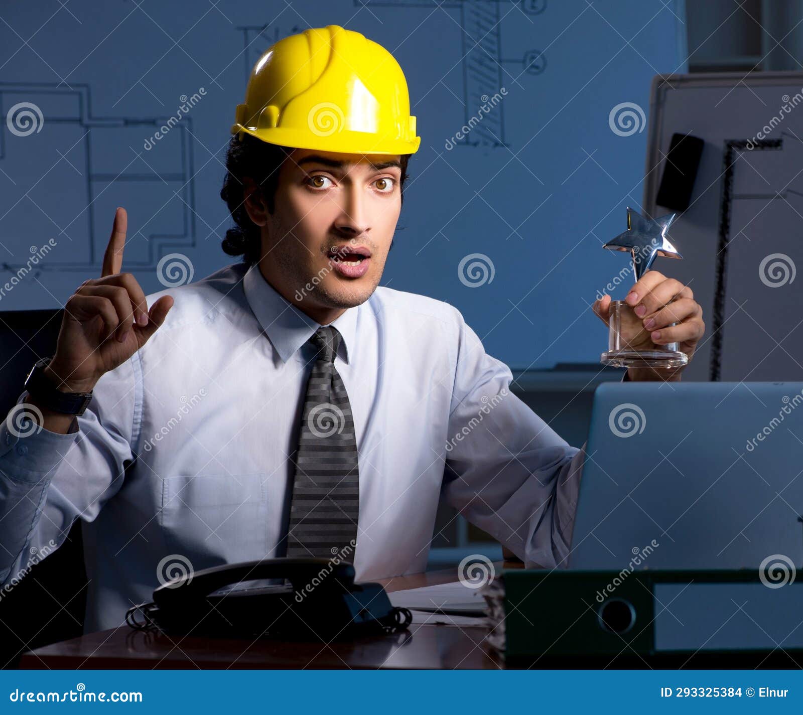 Young Construction Architect Working on Project at Night Stock Photo ...