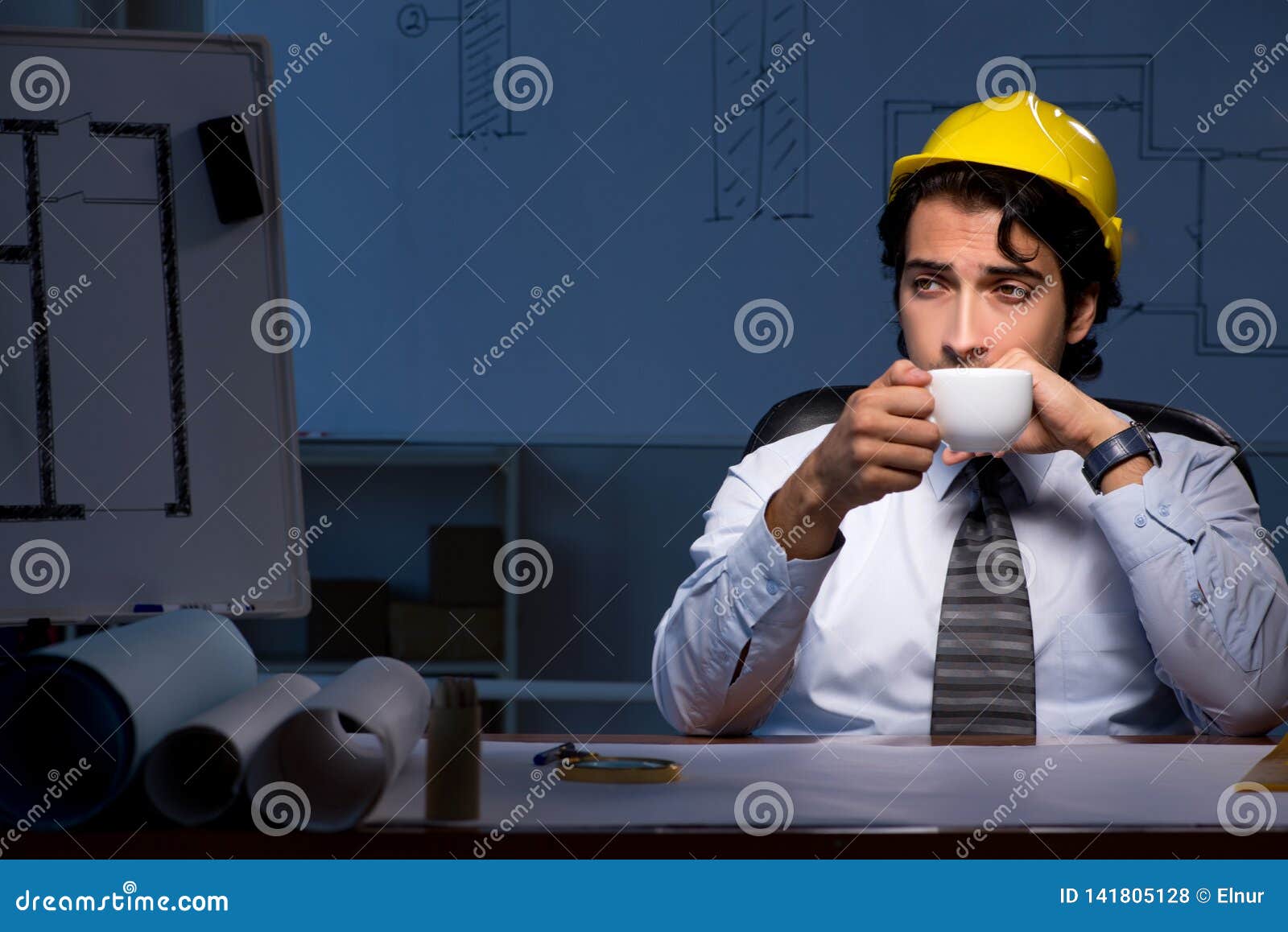 The Young Construction Architect Working on Project at Night Stock ...