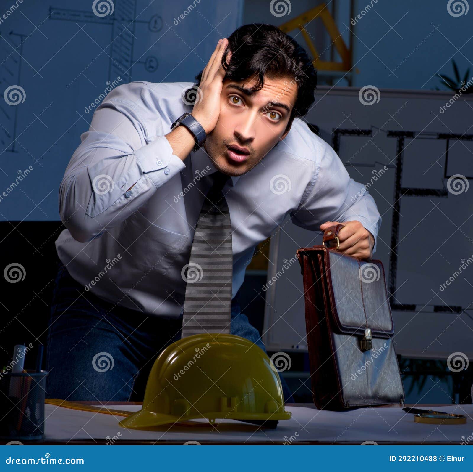 Young Construction Architect Working on Project at Night Stock Photo ...