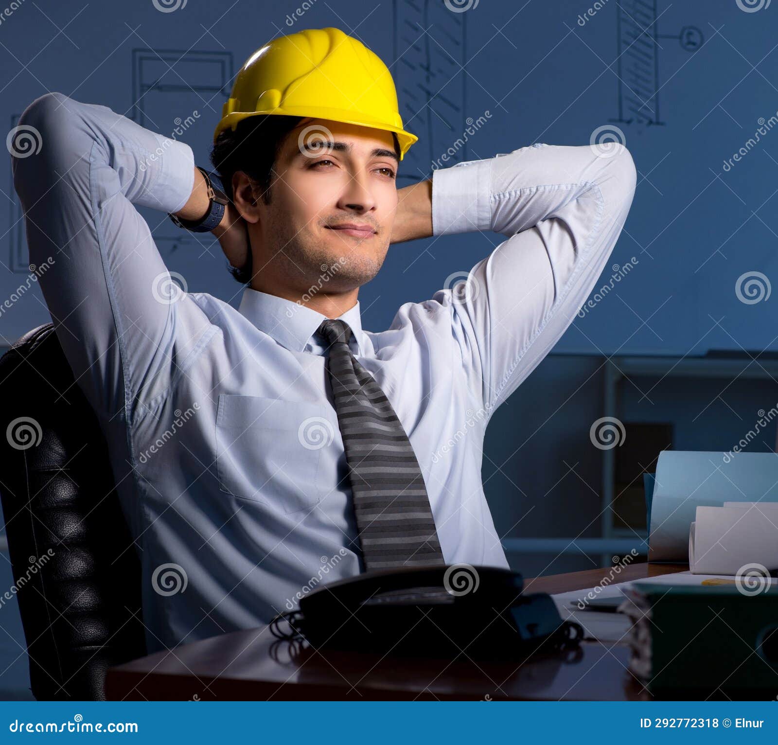 Young Construction Architect Working on Project at Night Stock Photo ...