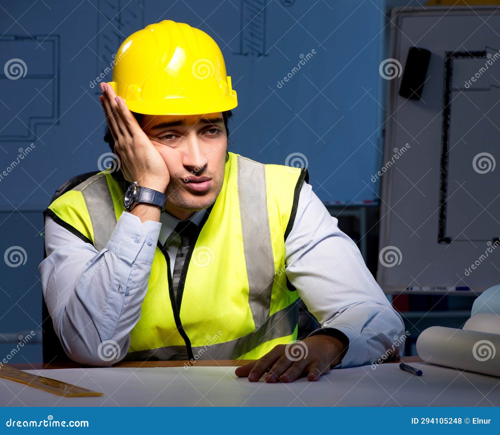 Young Construction Architect Working on Project at Night Stock Photo ...