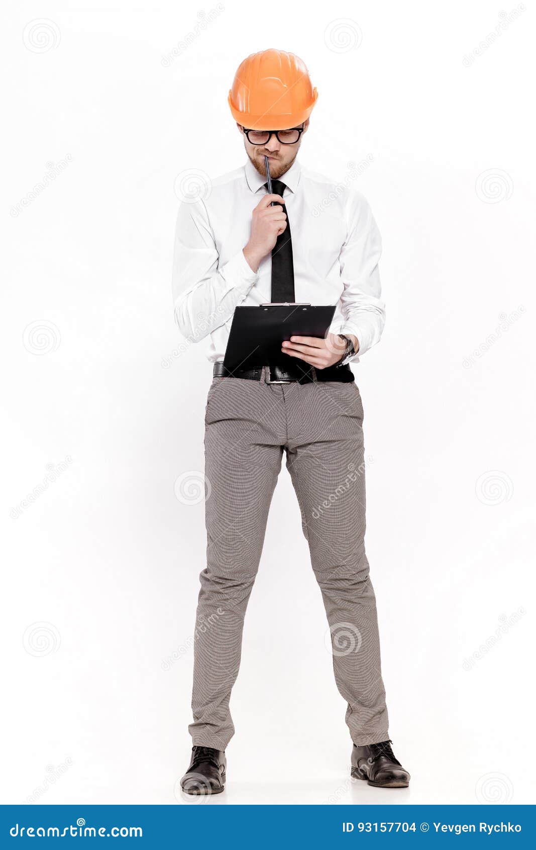 Young Construction Engineer in Orange Helmet with Folder Thinking on ...