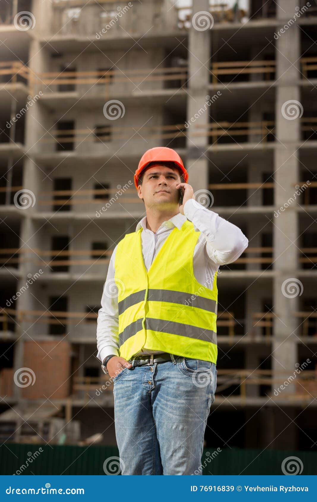 Young Construction Engineer Talking by Phone on Building Site Stock ...