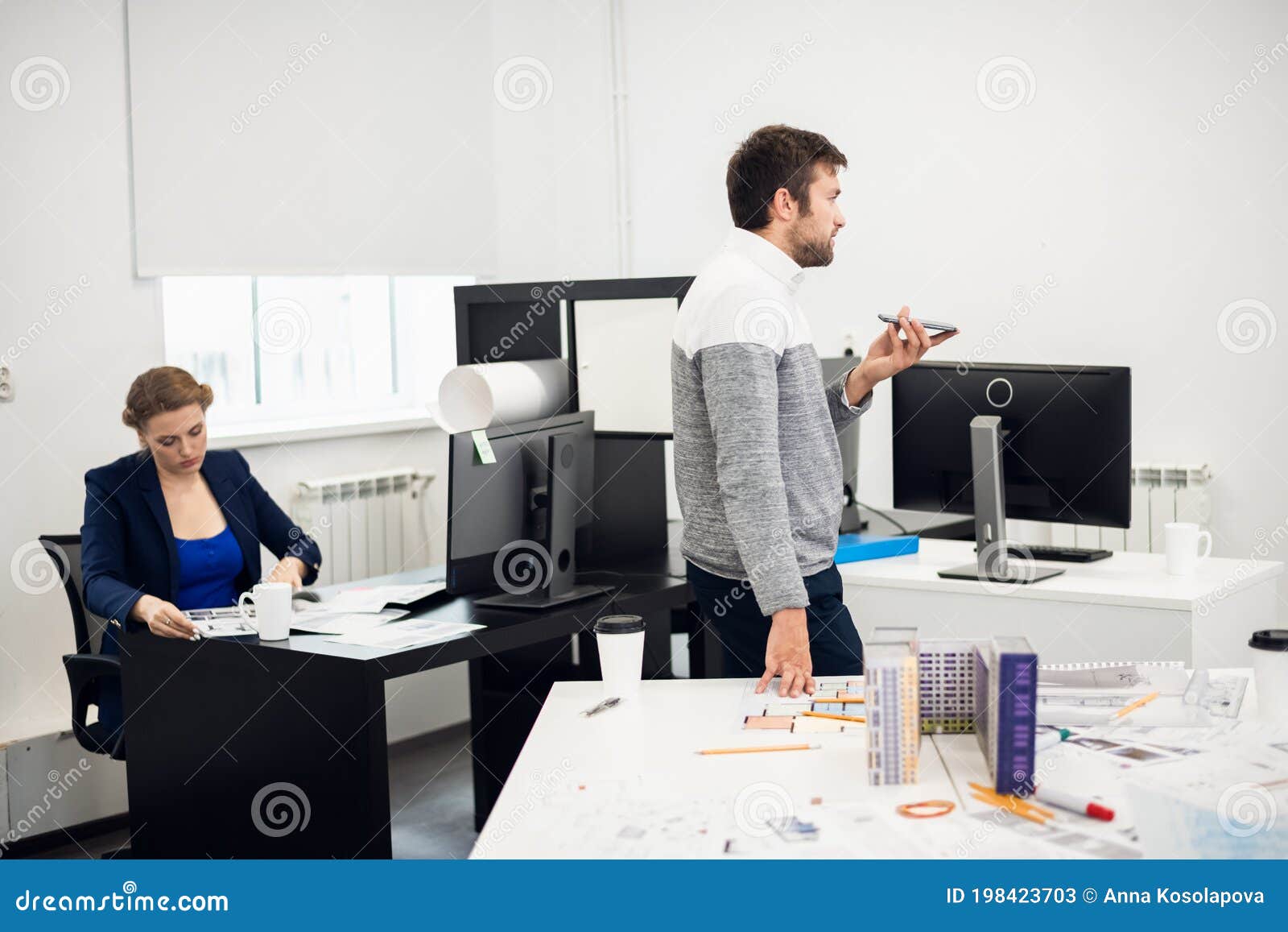 A Young Construction Engineer is Talking To Someone Using the Sp Stock ...