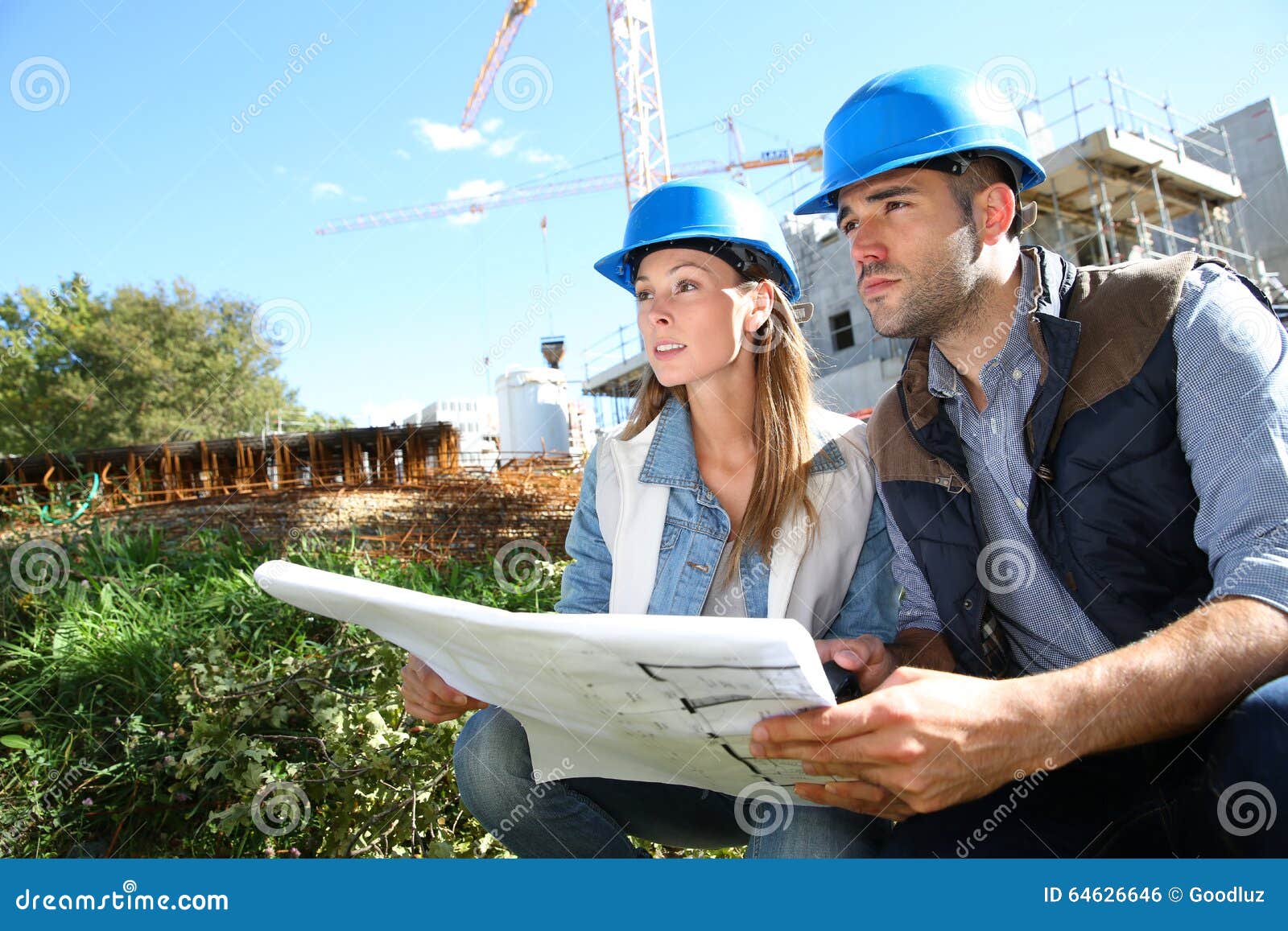 Young Construction Engineers with Blueprint on Site Stock Photo - Image ...